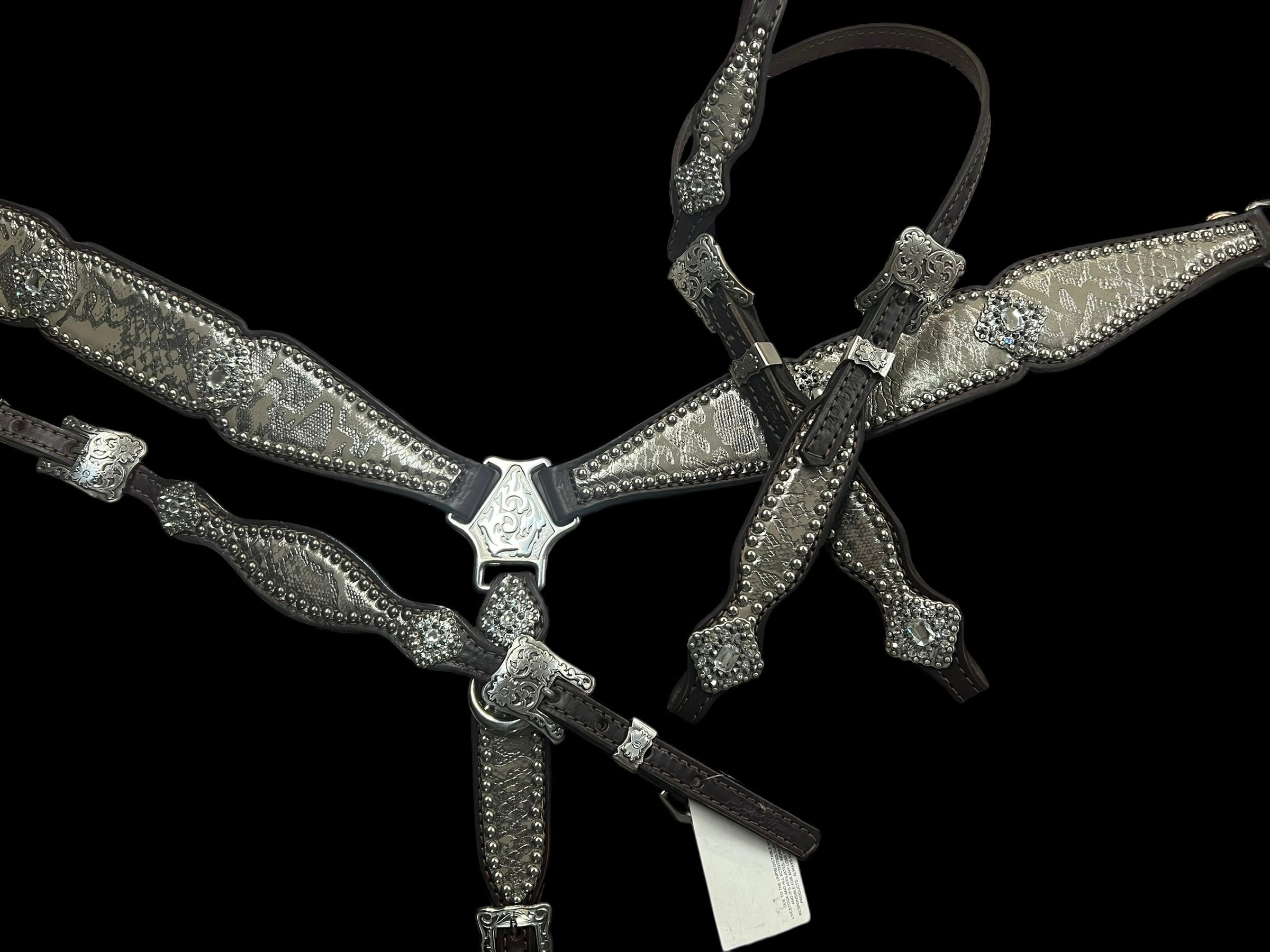 Silver snake on dark leather – Mandy's Custom Tack